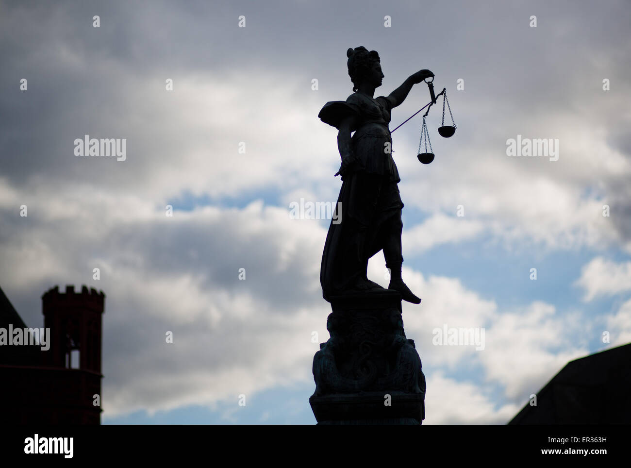 The statue of Justitia, the Roman goddess of justice, stands with a ...