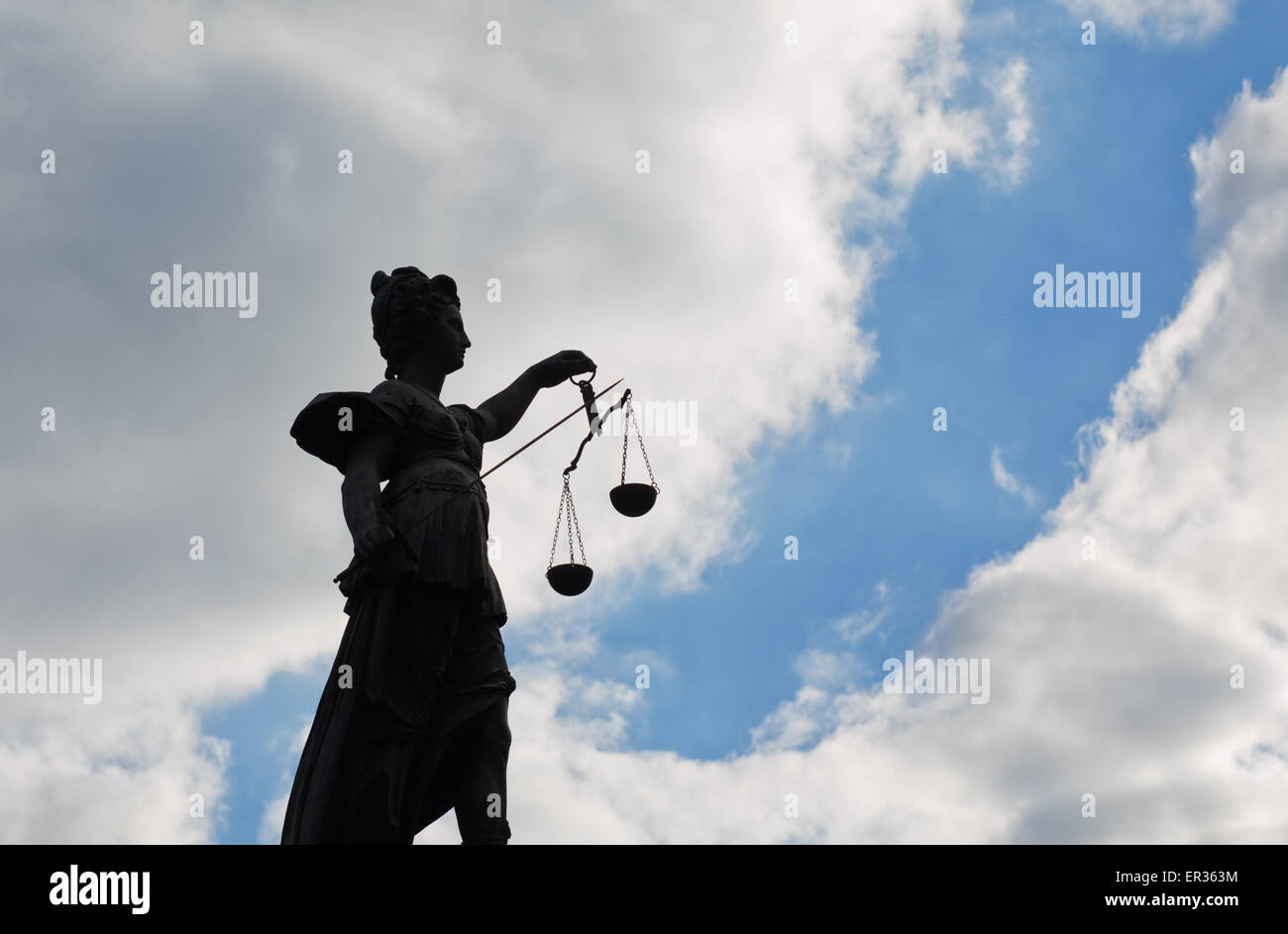The statue of Justitia, the Roman goddess of justice, stands with a ...