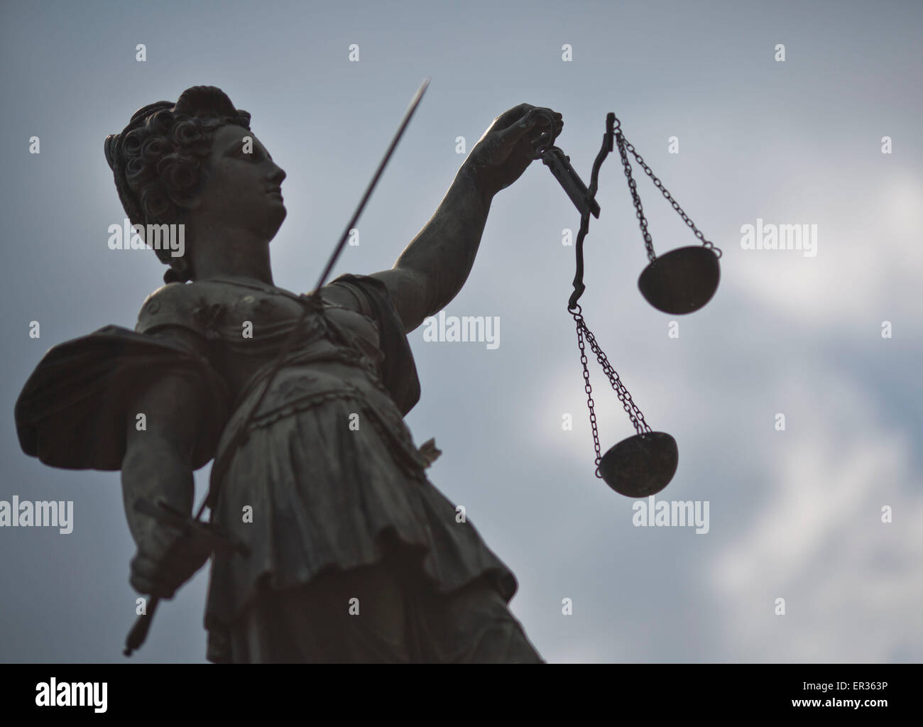 The statue of Justitia, the Roman goddess of justice, stands with a ...
