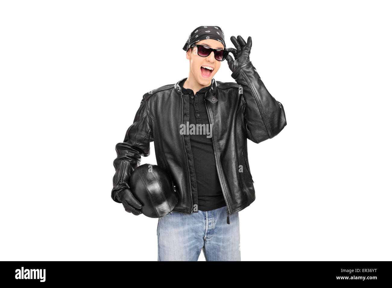 Young biker with sunglasses and leather jacket looking at the camera ...