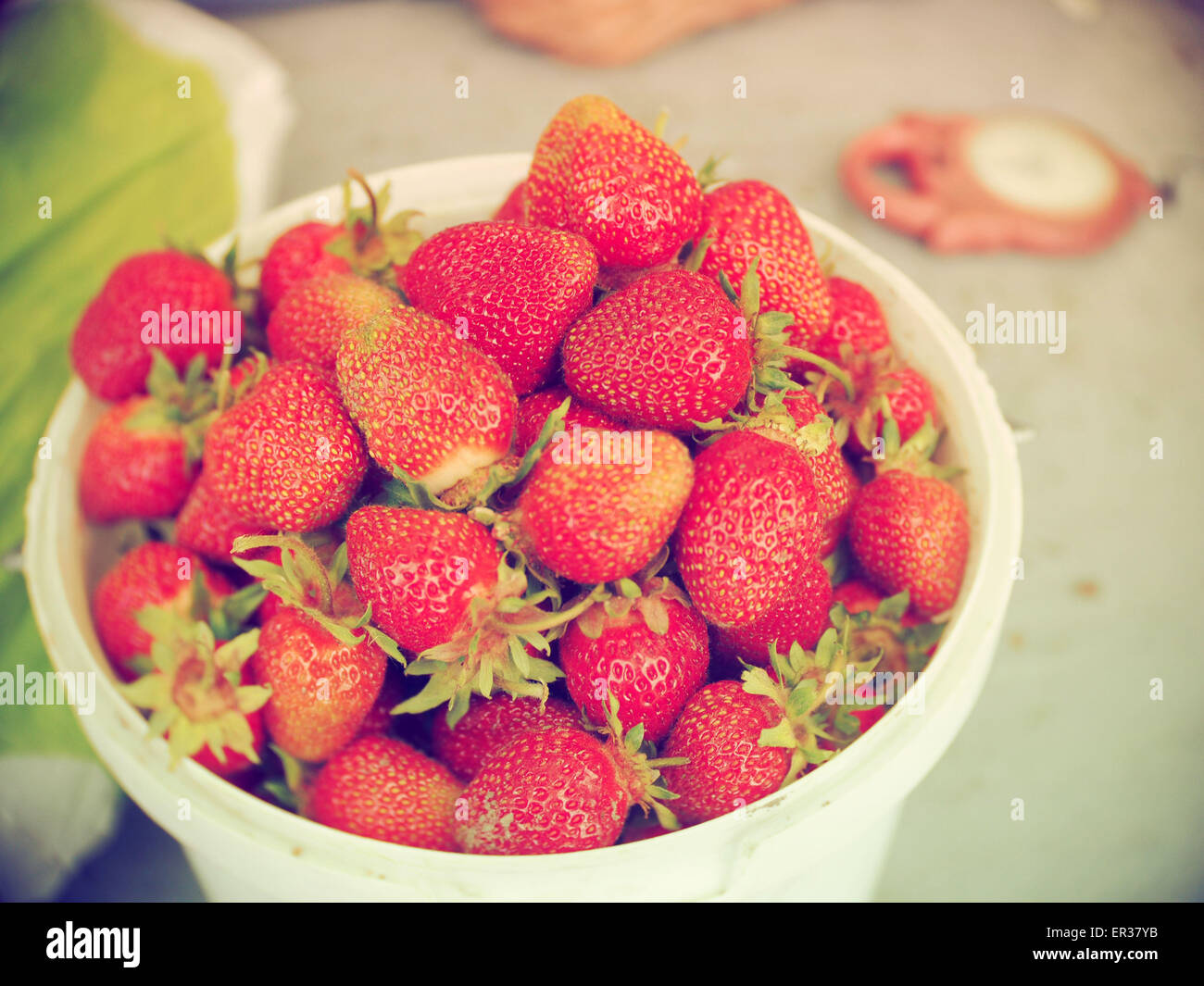 May 26, 2015 - Bucket with strawberries at a farmers market. Soft focus ...