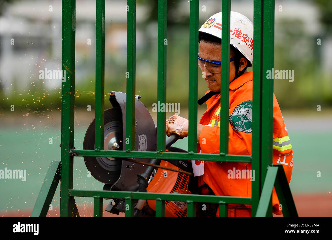 Nanjing, China's Jiangsu Province. 26th May, 2015. A fireman cuts the ...