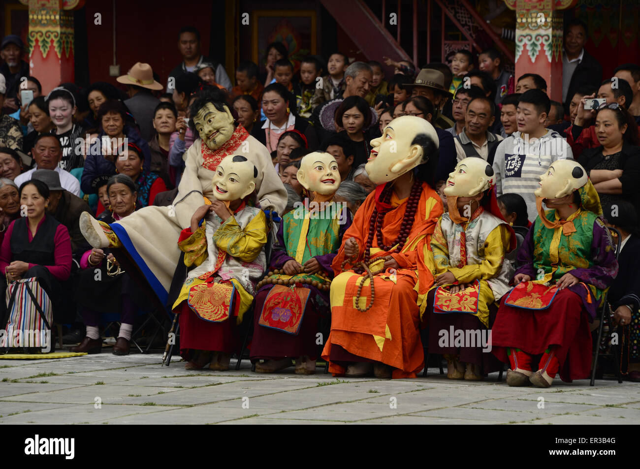 Kangding, China. 26th May, 2015. Monks with mask dance at a pilgrimage ...