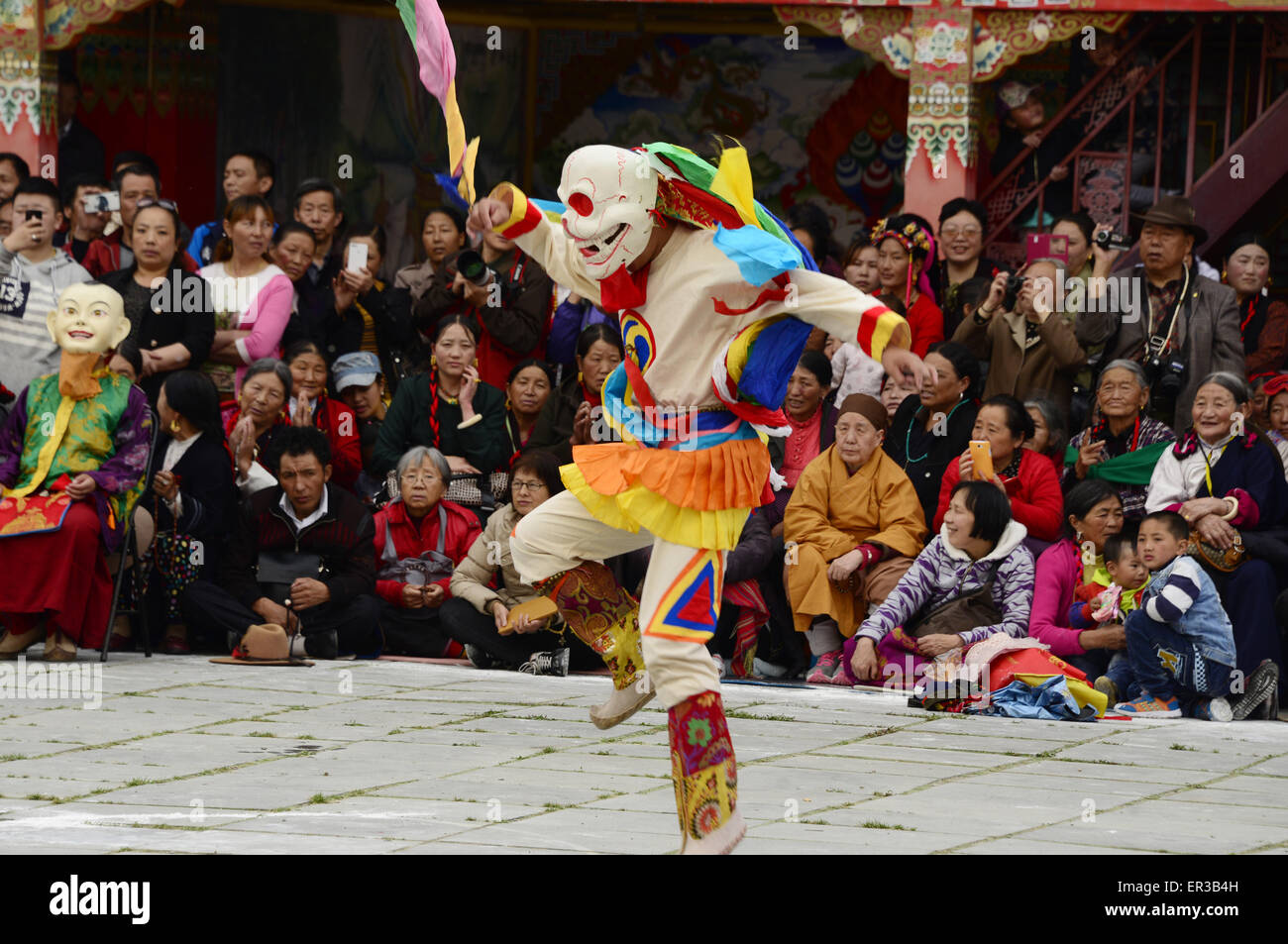 Kangding, China. 26th May, 2015. Monks with mask dance at a pilgrimage ...