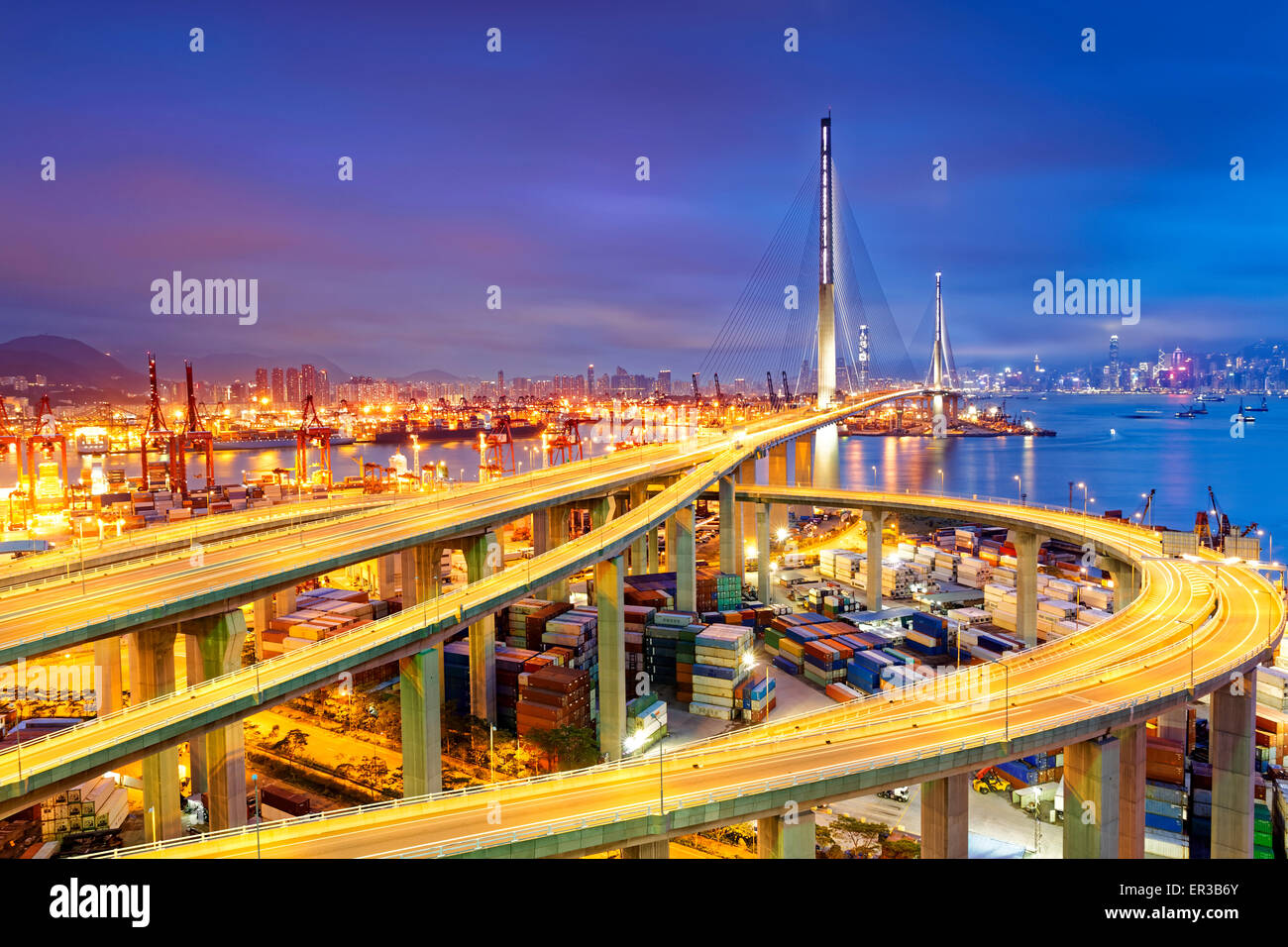 Container Cargo freight ship with working crane bridge in shipyard ...