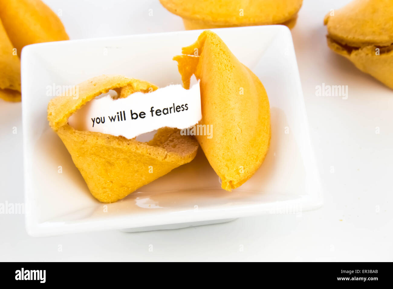 open fortune cookie with strip of white paper - YOU WILL BE FEARLESS ...