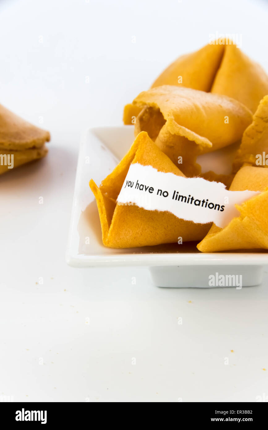 open fortune cookie with strip of white paper - YOU HAVE NO LIMITATIONS ...