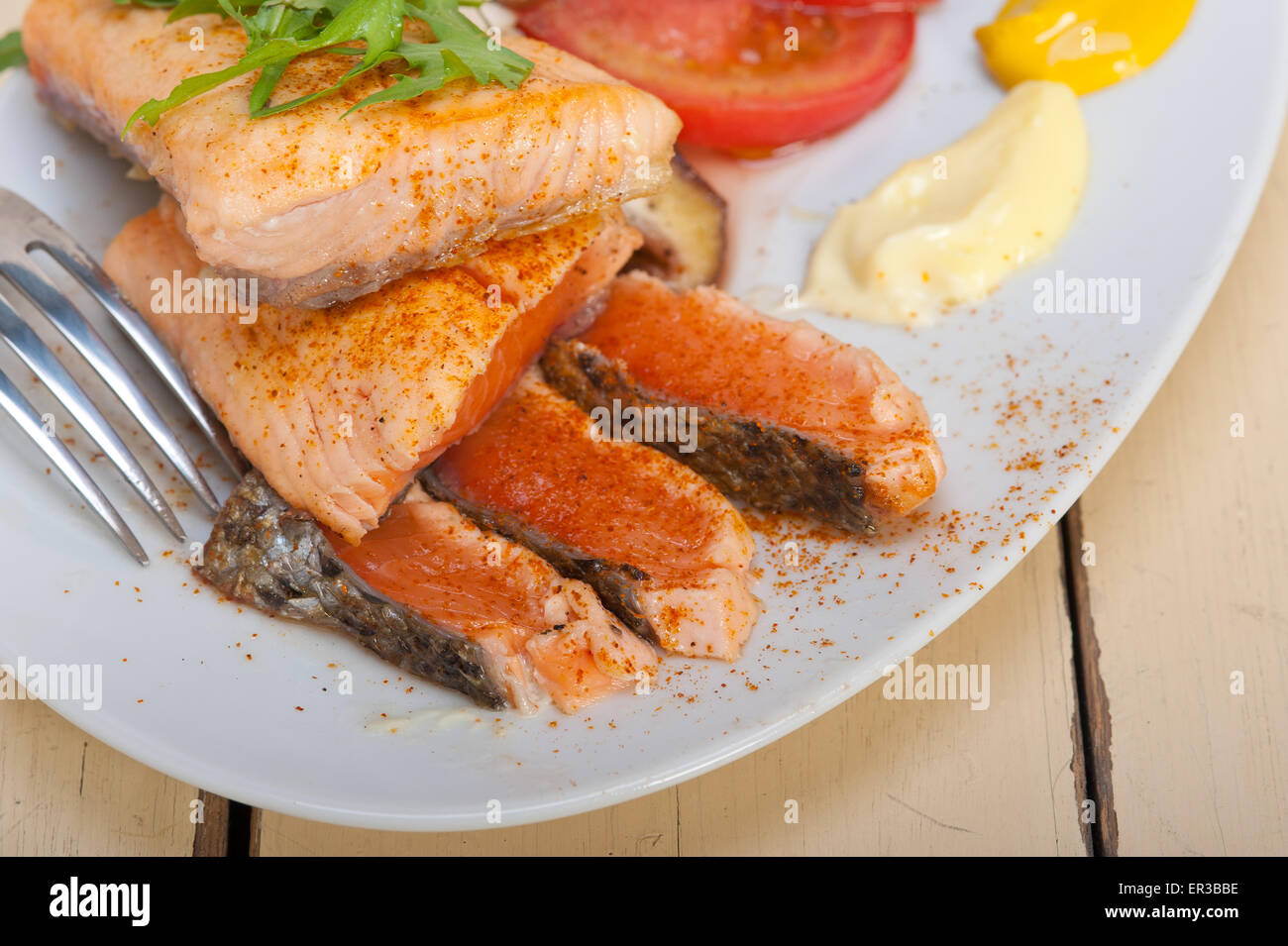 grilled fresh samon filet with vegetables salad tomato arugula ...