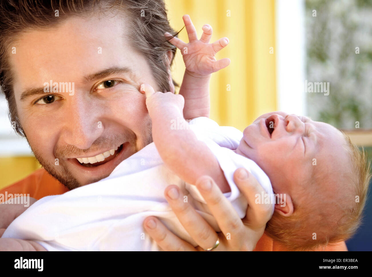 Proud father holding baby son Stock Photo - Alamy