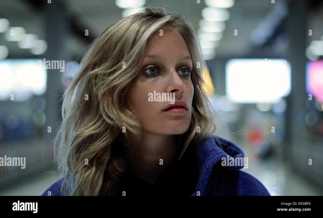 Portrait of a woman at a train station Stock Photo - Alamy