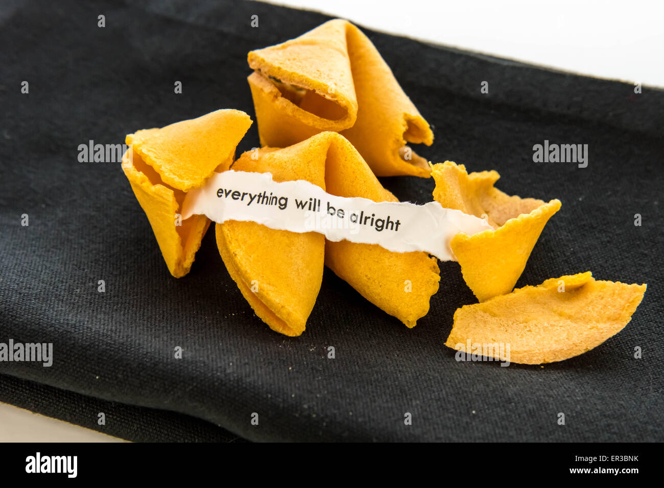 open fortune cookie with strip of white paper - EVERYTHING WILL BE ...