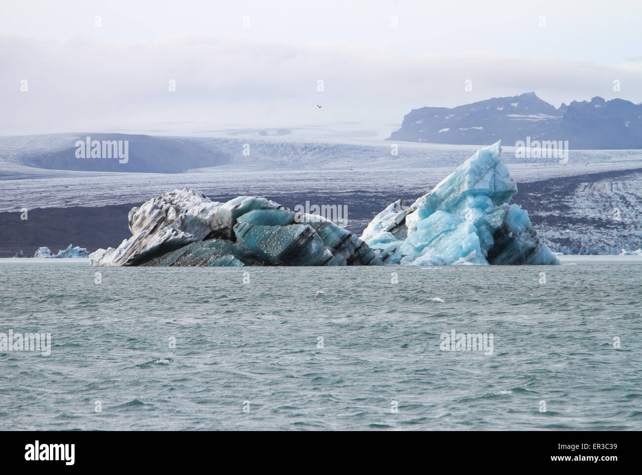 Close-up of a black striped iceberg, Jokulsarlon, Vatnajokull Glacier ...