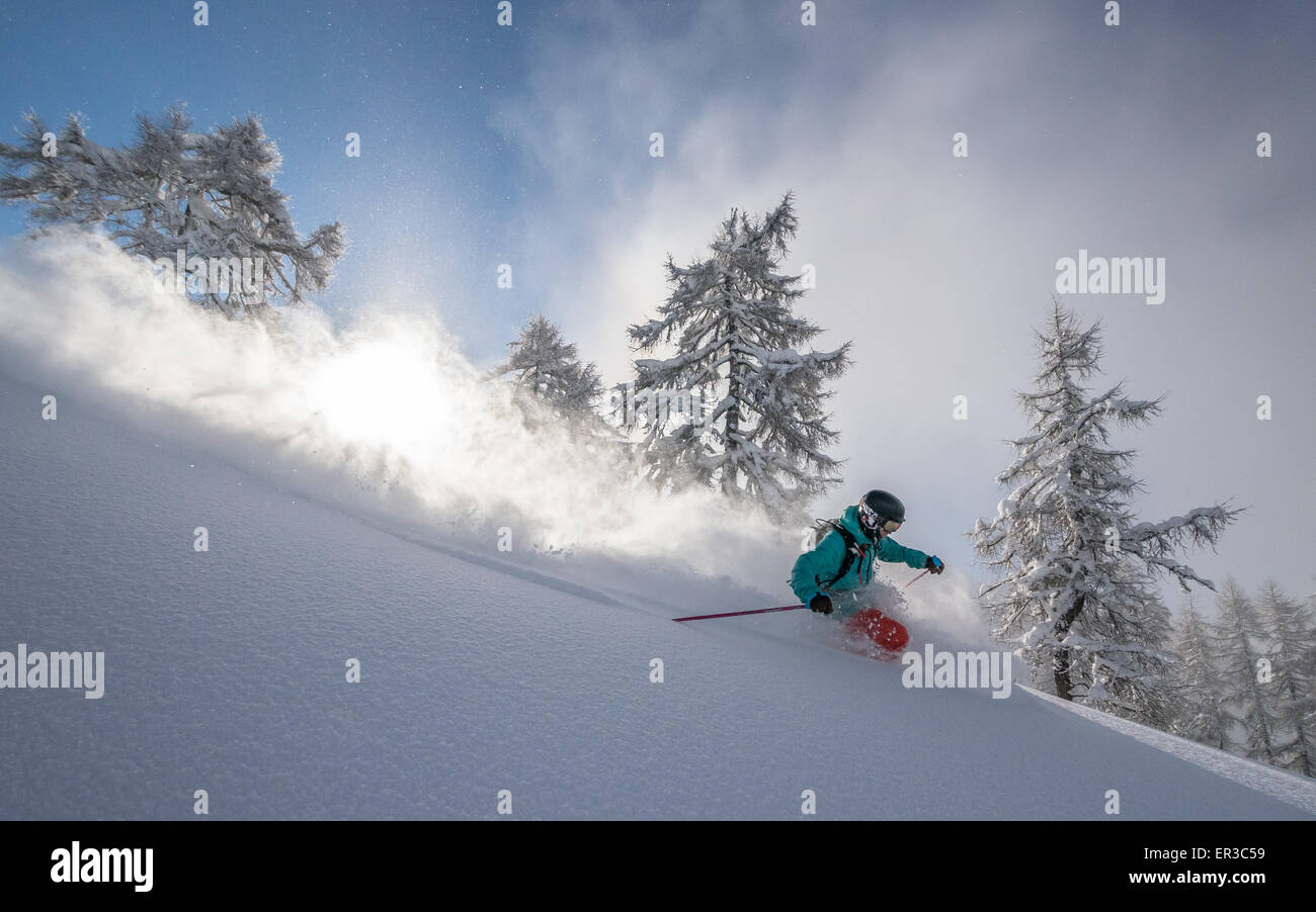 Man deep powder skiing in Austria Stock Photo - Alamy