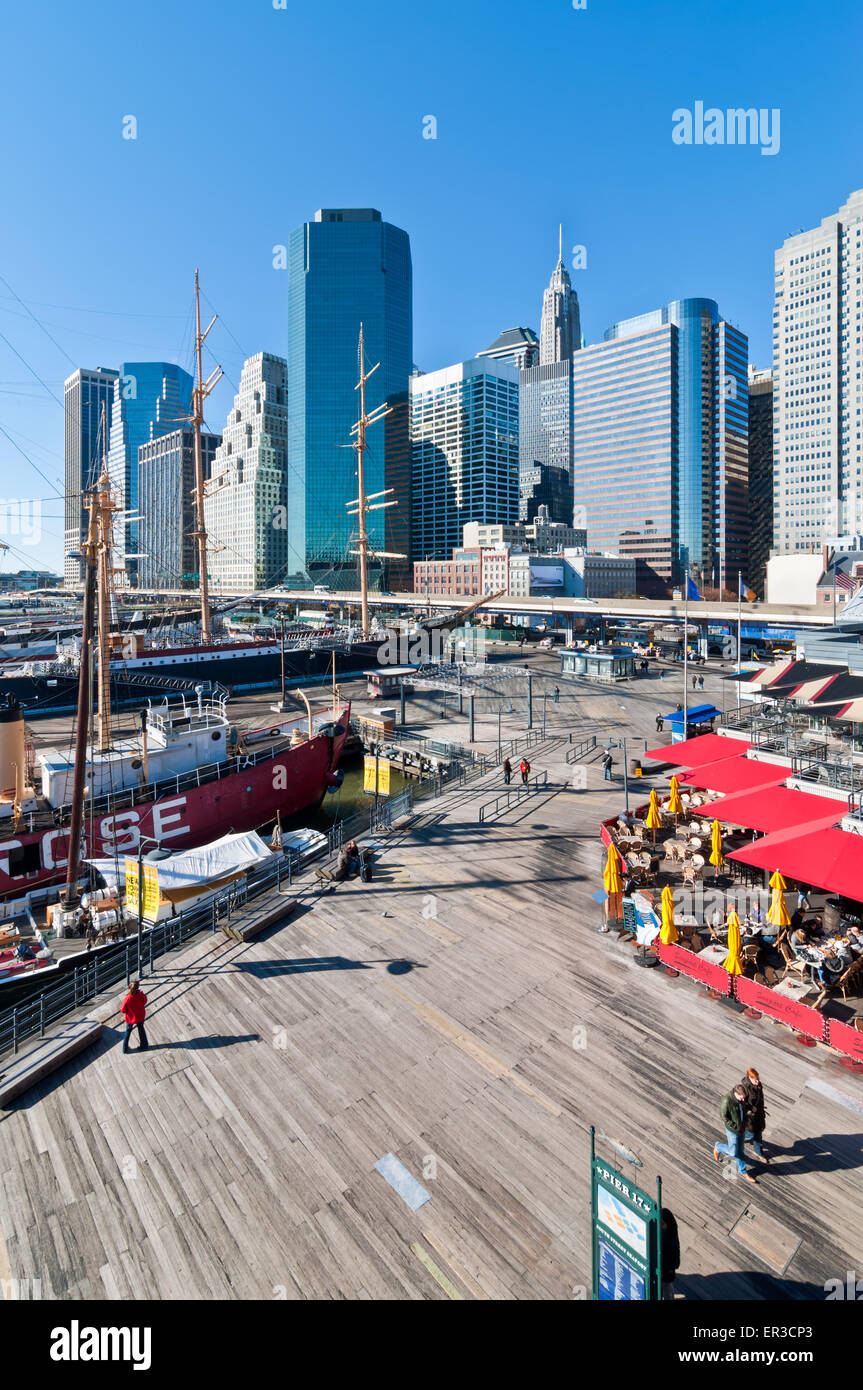 People walk in Landmark seaport located next to Wall Street and ...