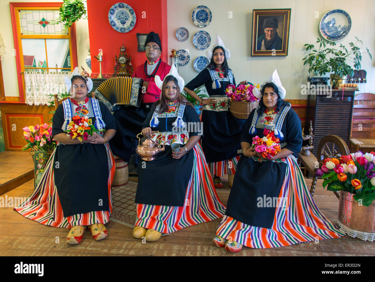 Tourists dressing up in old Dutch folklore dresses in Volendam, Holland ...