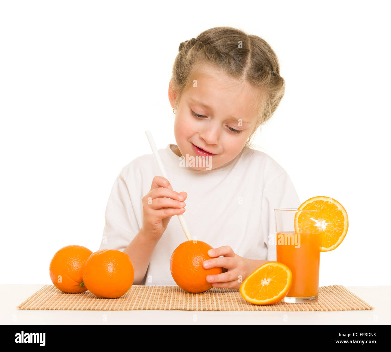 little girl with oranges drink juice with a straw Stock Photo - Alamy