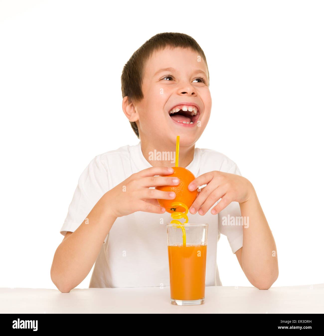 boy drink orange juice with a straw Stock Photo - Alamy