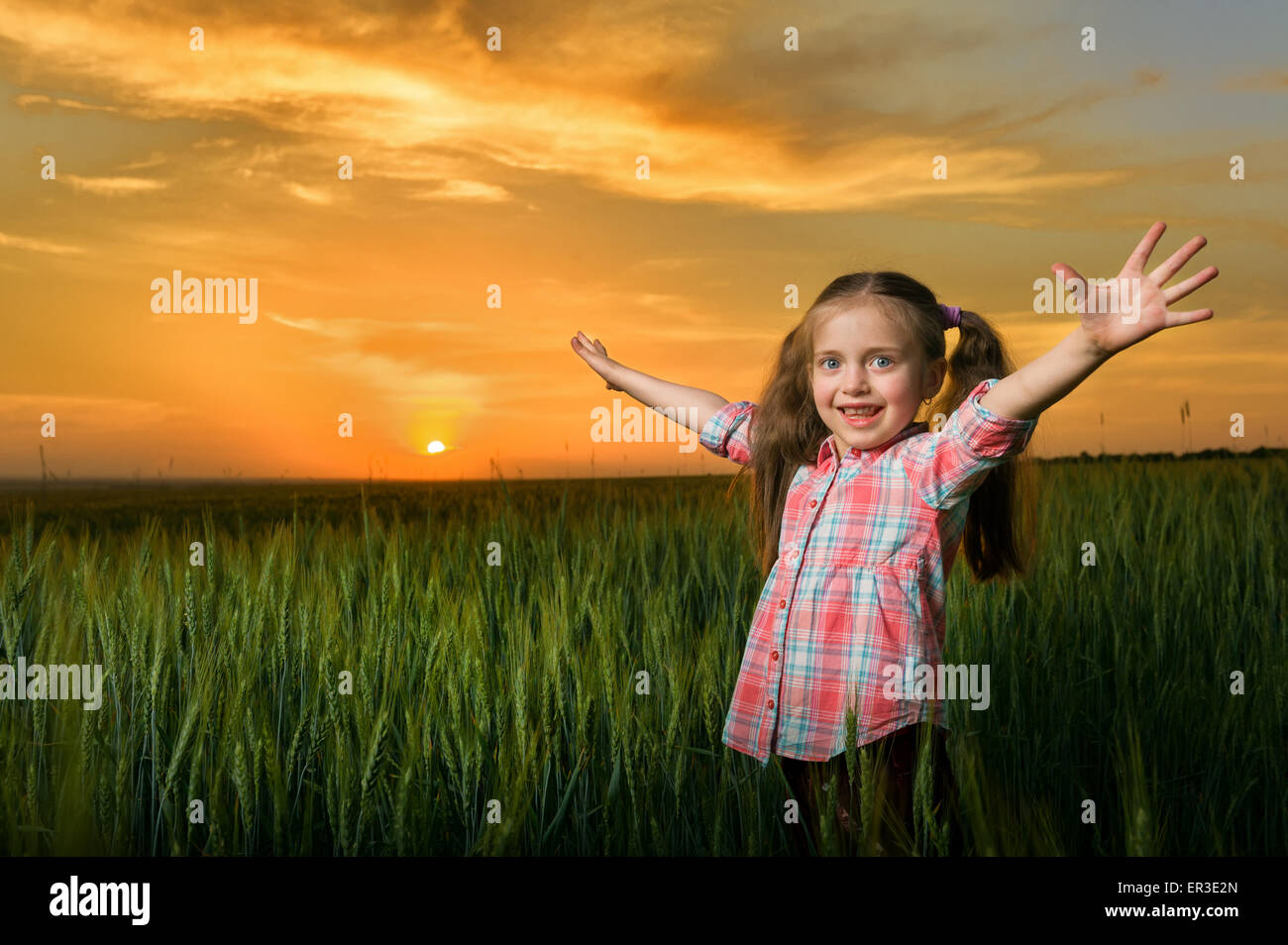 girl open arms at sunset Stock Photo - Alamy