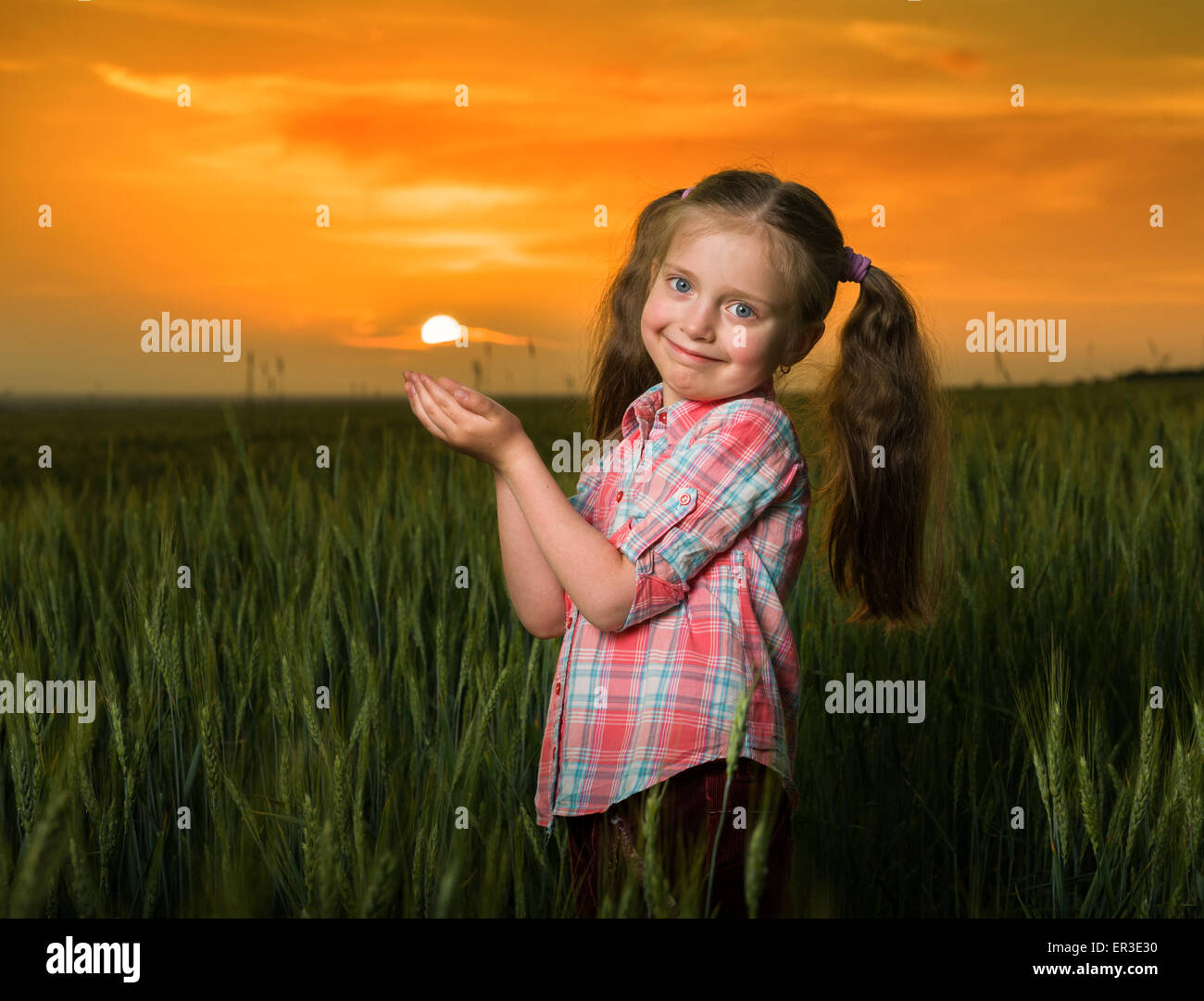 girl hold sun in her palms Stock Photo - Alamy