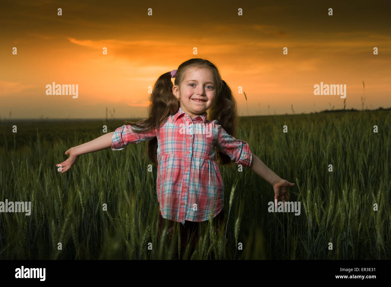 little girl at sunset Stock Photo - Alamy