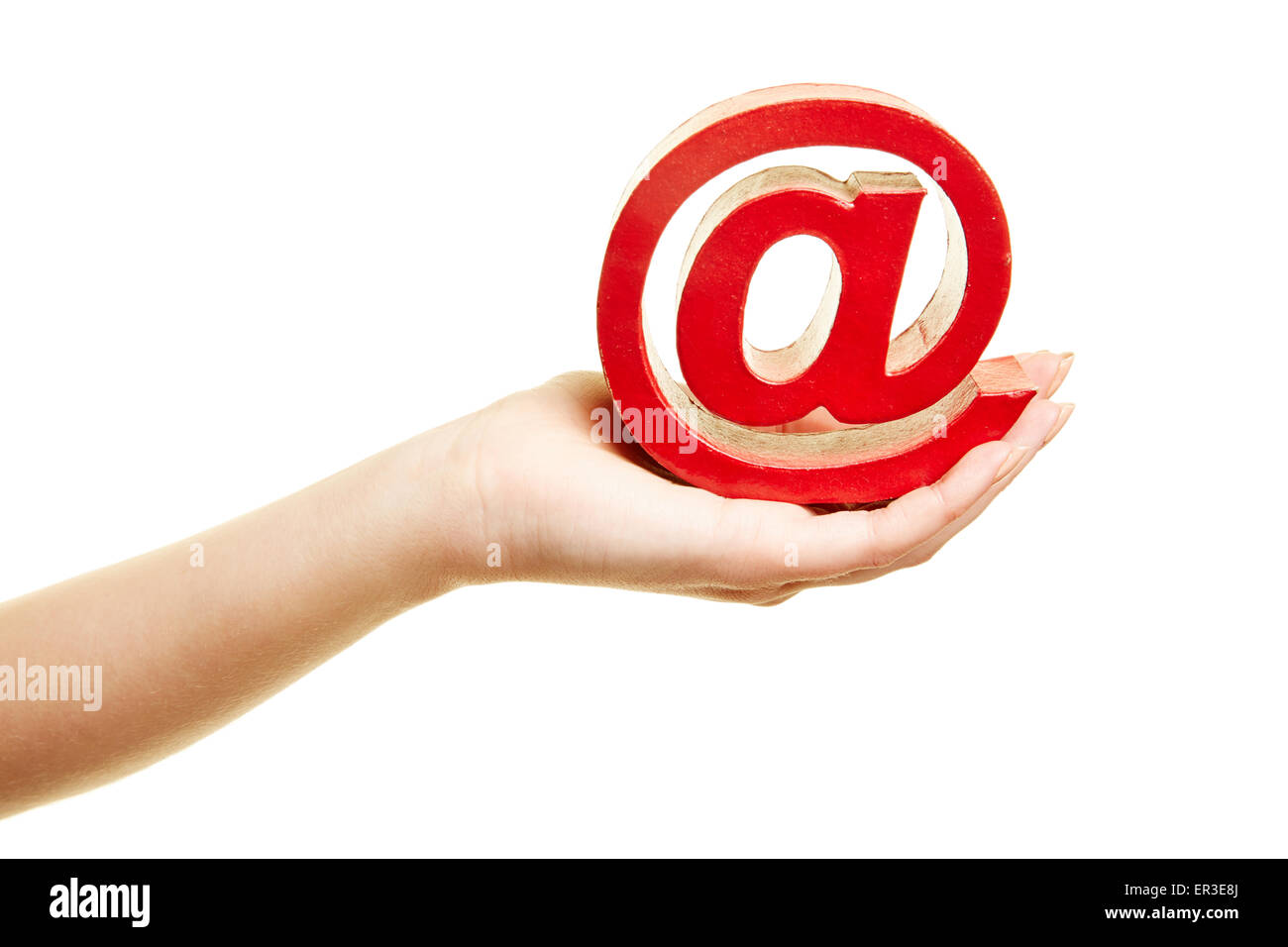 Hand holding a big red at sign as symbol for email and internet Stock ...