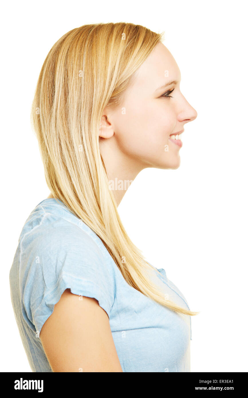 Profile view of young blonde happy woman smiling Stock Photo - Alamy