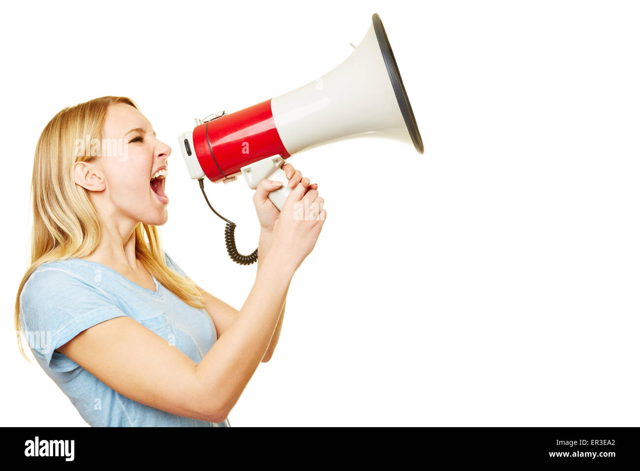 Young blonde woman screaming loudly into a big megaphone Stock Photo ...