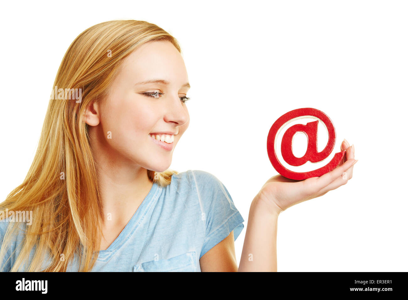 Woman holding a red at sign on her hand as symbol for email Stock Photo ...