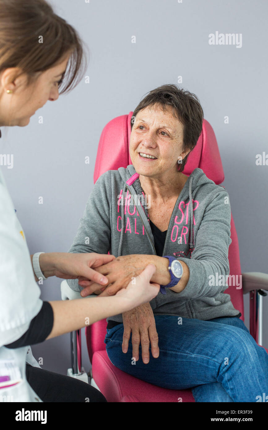 Rheumatologist examining a patient with rheumatoid arthritis, Bordeaux ...