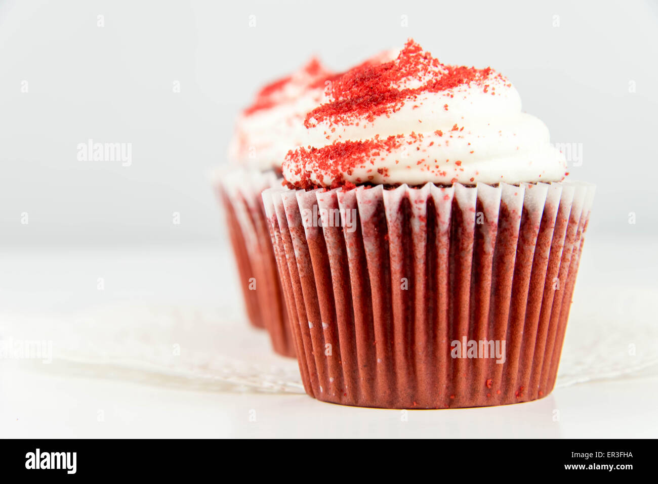 red velvet cupcakes with white frosting and red sprinkles Stock Photo ...