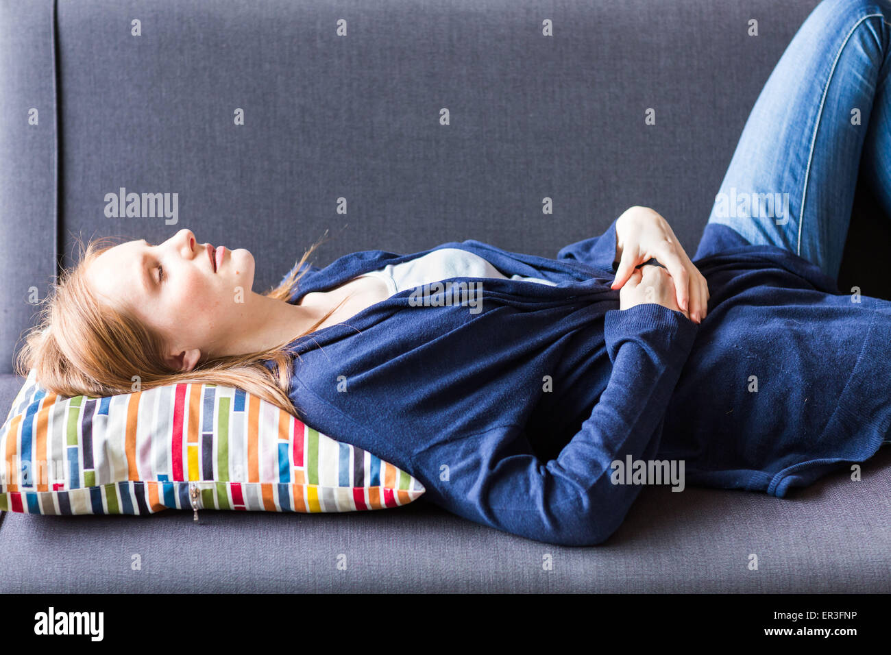 Woman taking a nap sofa hi-res stock photography and images - Alamy