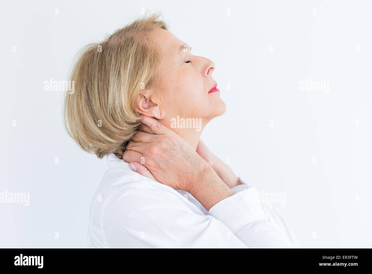 Old senior woman neck pain hi-res stock photography and images - Alamy