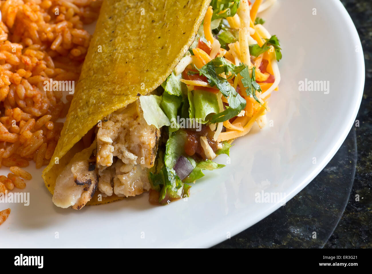Chicken Hard Shell Taco with Mexican rice and sour cream Stock Photo ...