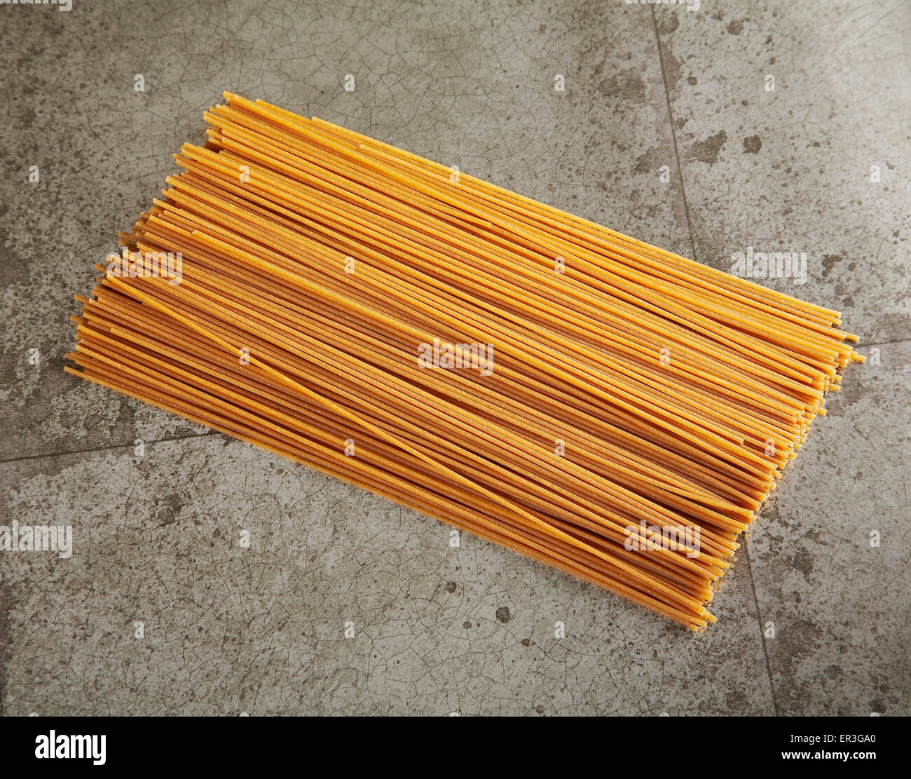Brown wholewheat dried uncooked spaghetti Stock Photo - Alamy