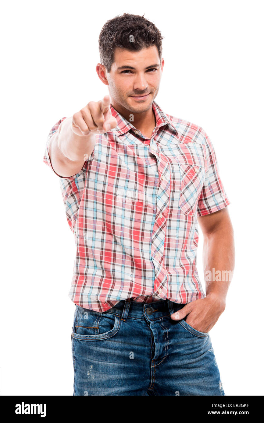 Handsome latin man pointing to the camera, isolated over a white ...