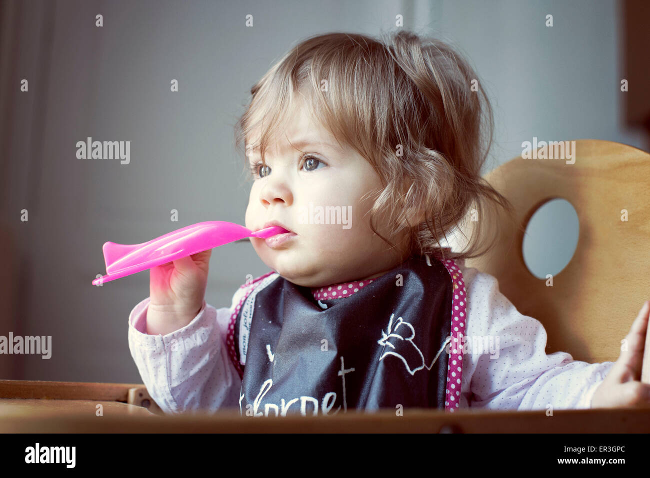 Baby eating by herself hi-res stock photography and images - Alamy