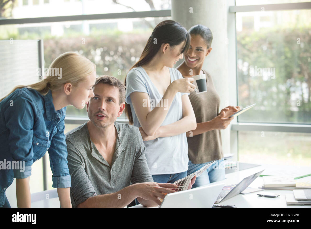 Office workers bonding Stock Photo - Alamy
