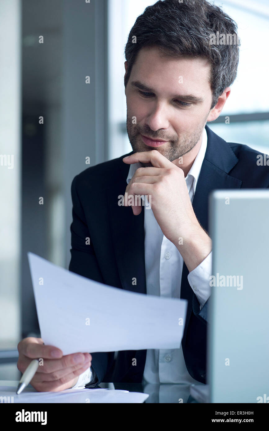 Businessman reading document Stock Photo - Alamy Businessman reading document Stock Photo - Alamy