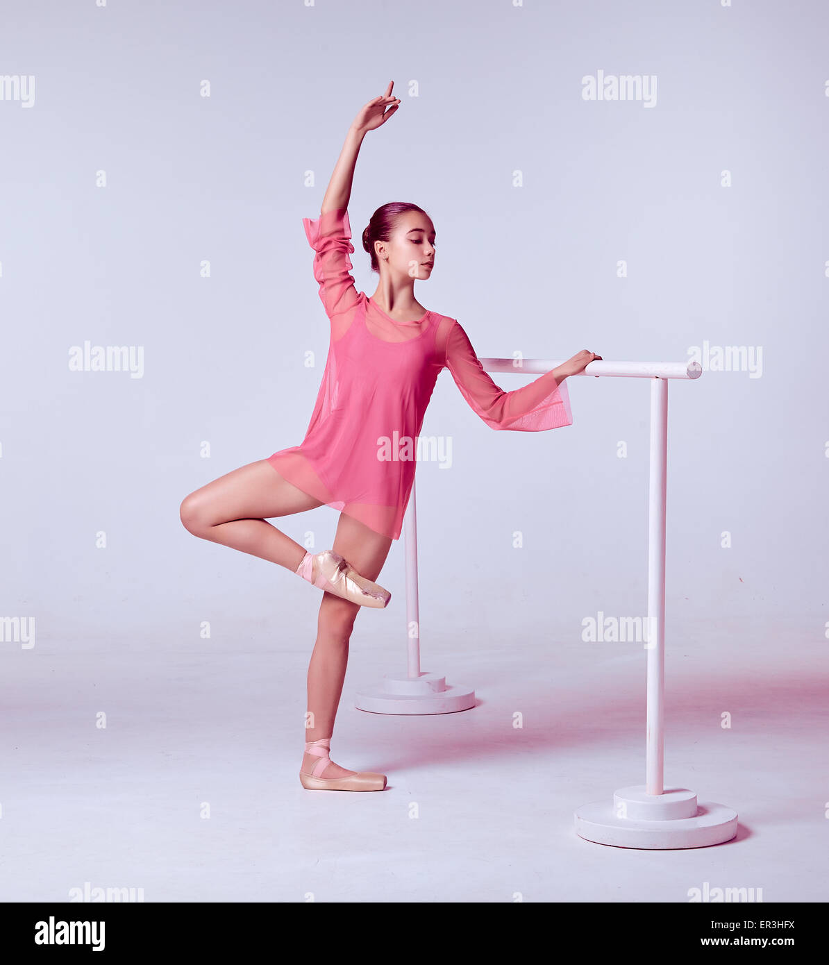 Ballerina stretching on the bar Stock Photo - Alamy