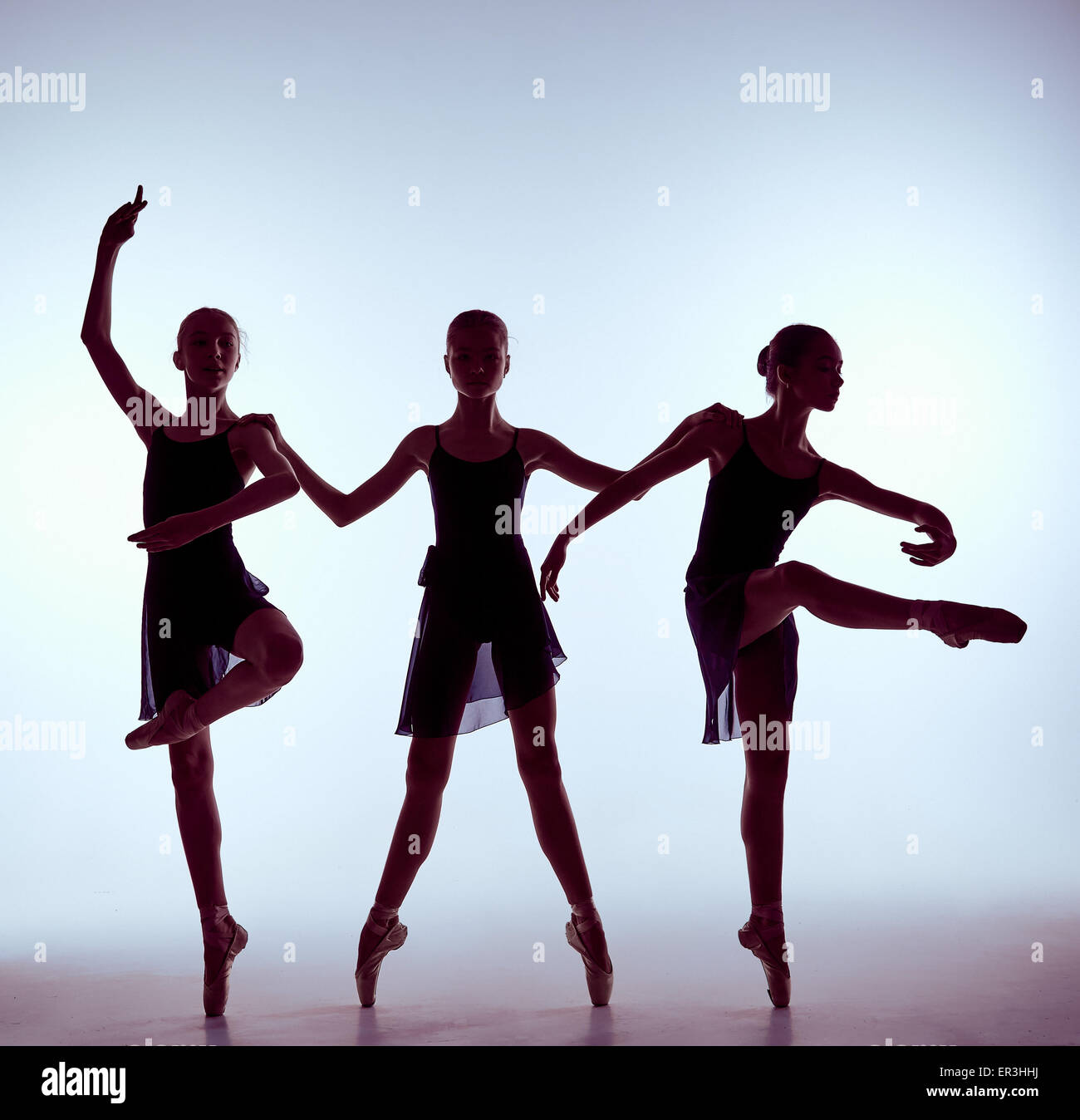 Composition from silhouettes of three young ballet dancers Stock Photo ...