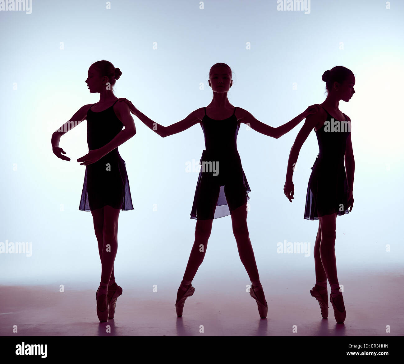 Composition from silhouettes of three young ballet dancers Stock Photo ...
