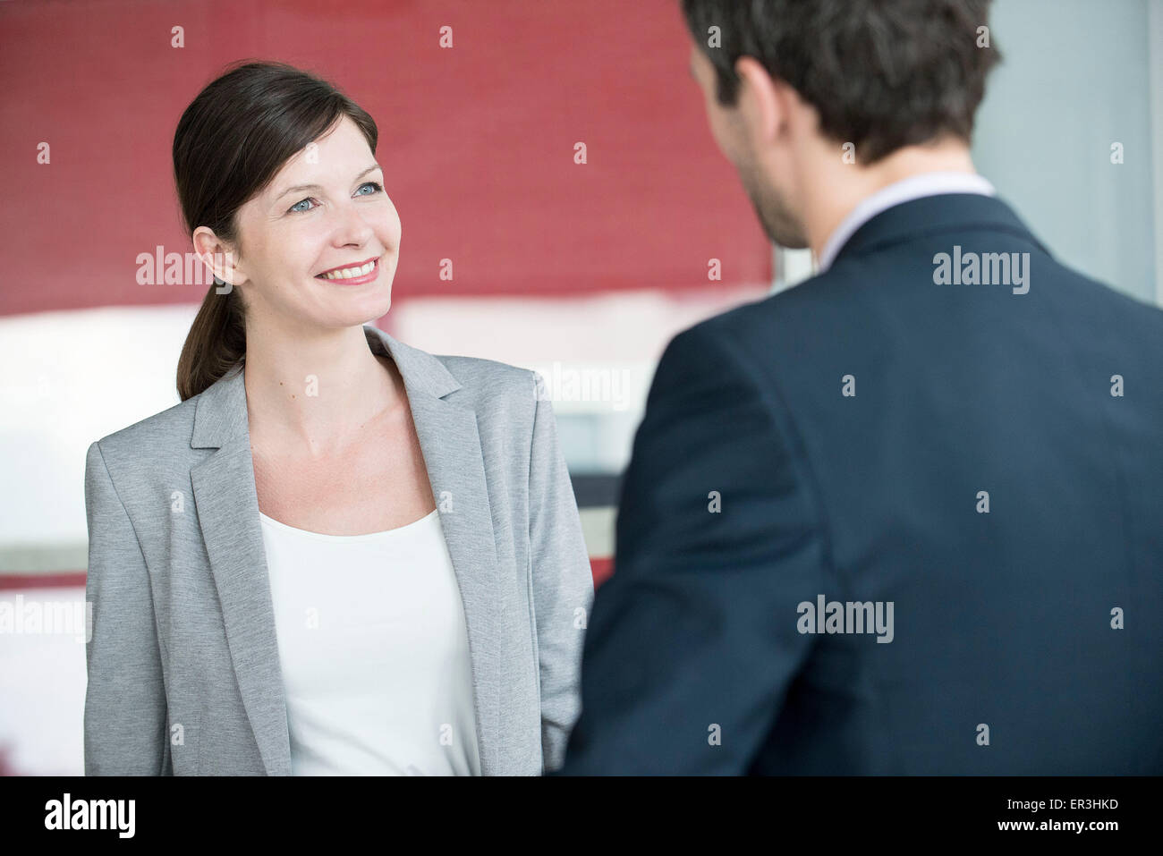 Hotel Receptionist And Guest Stock Photos & Hotel Receptionist And ...