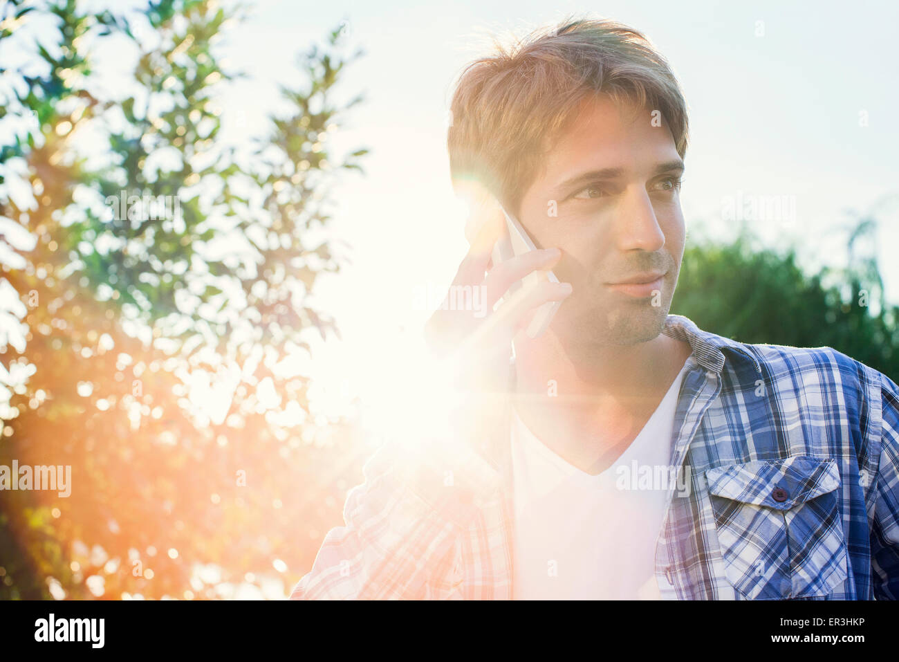 Man using cell phone outdoors Stock Photo - Alamy