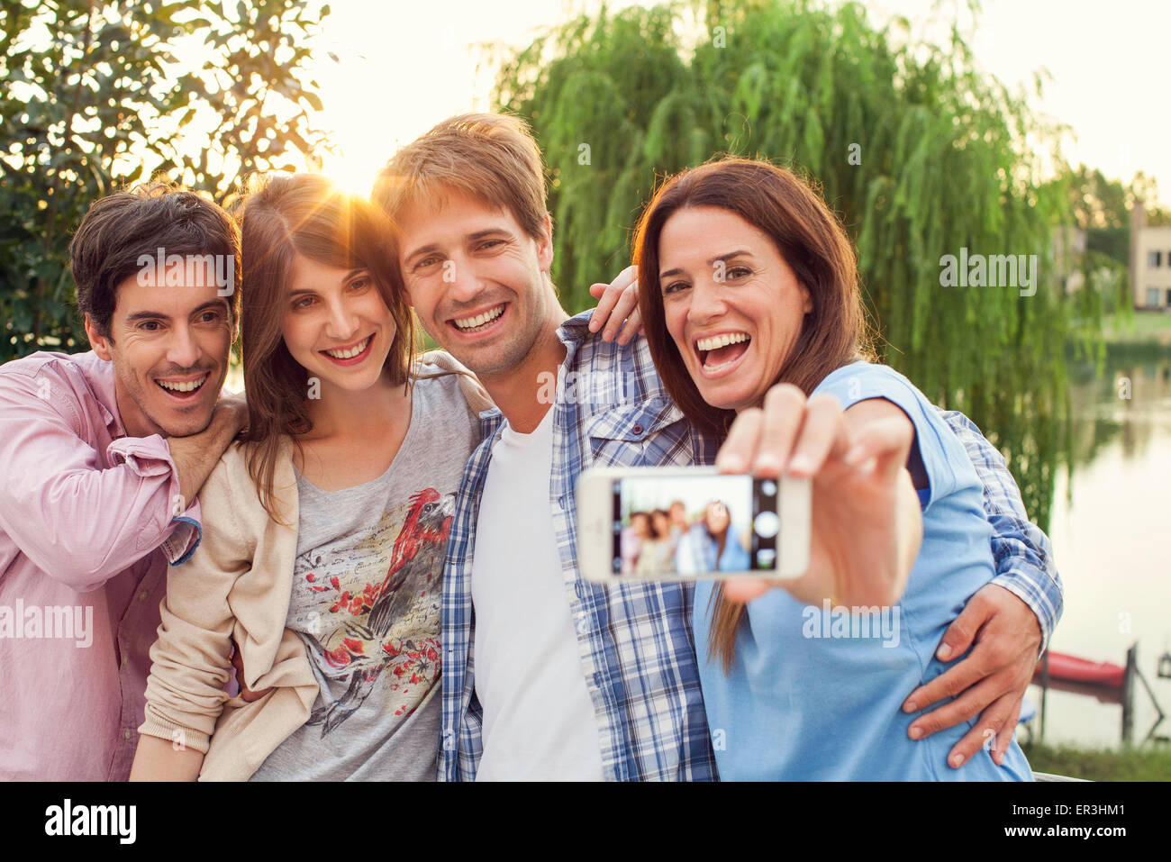 College friends taking group selfie Stock Photo - Alamy