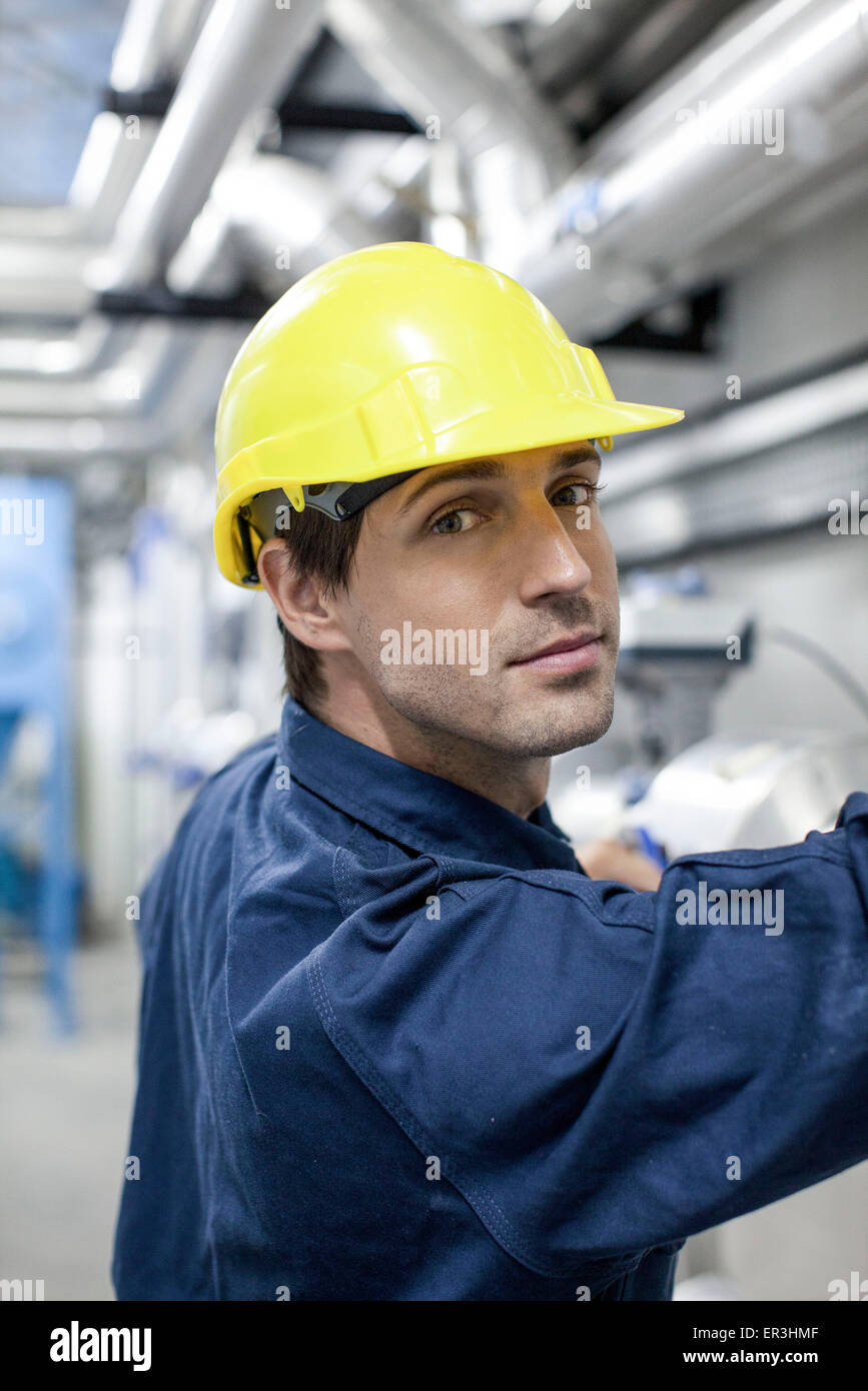 Worker at work in factory Stock Photo - Alamy