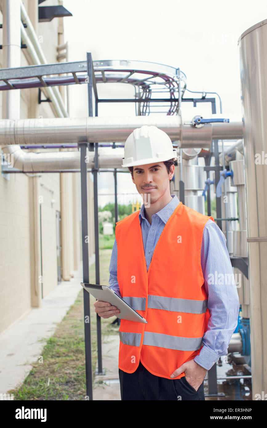 Engineer inspecting industrial site Stock Photo - Alamy