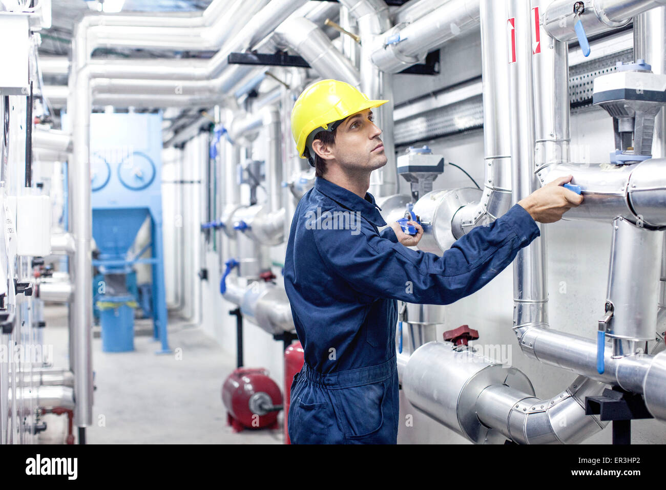 Engineer working in industrial plant Stock Photo - Alamy