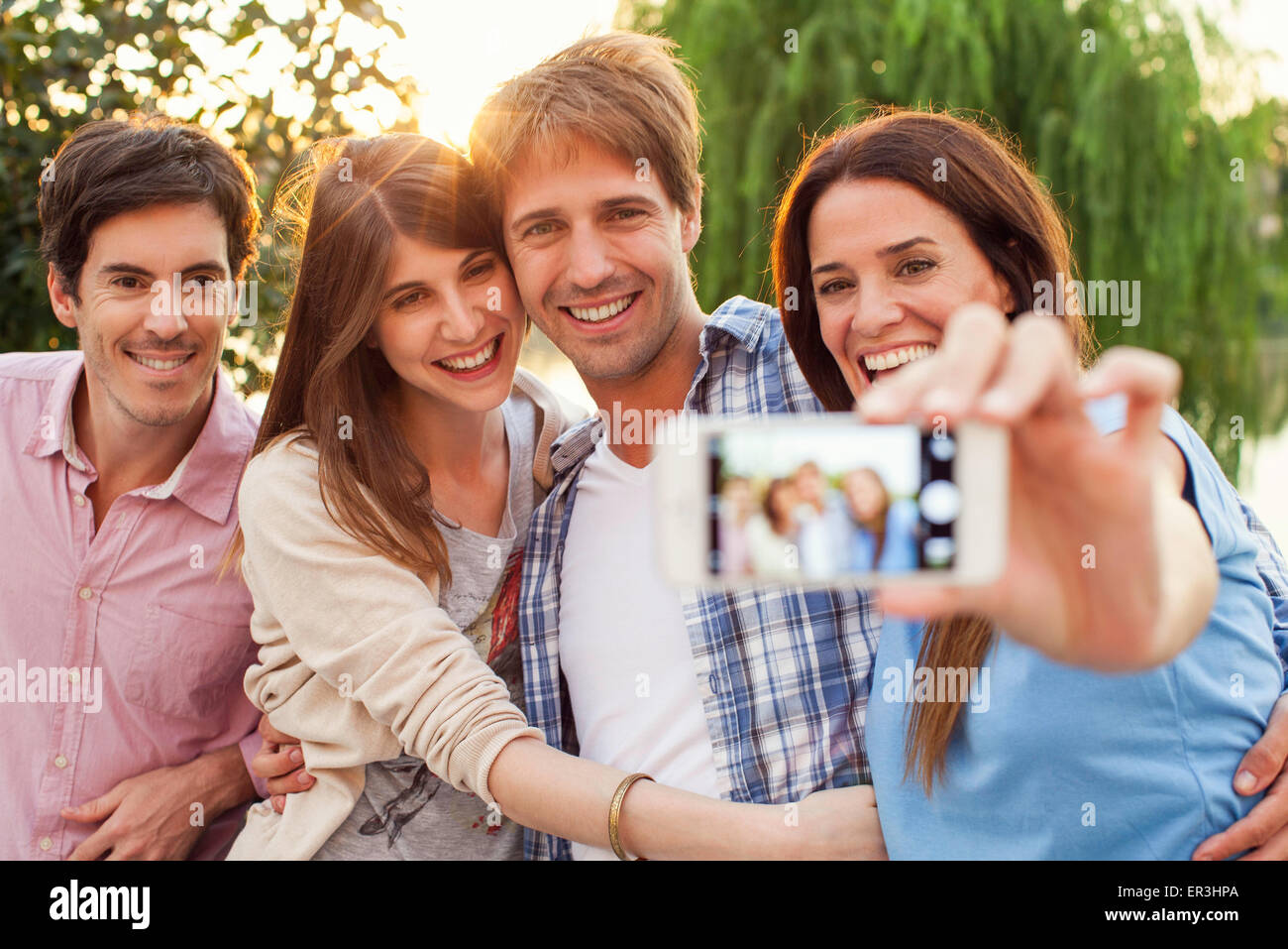 Friends taking group selfie Stock Photo - Alamy