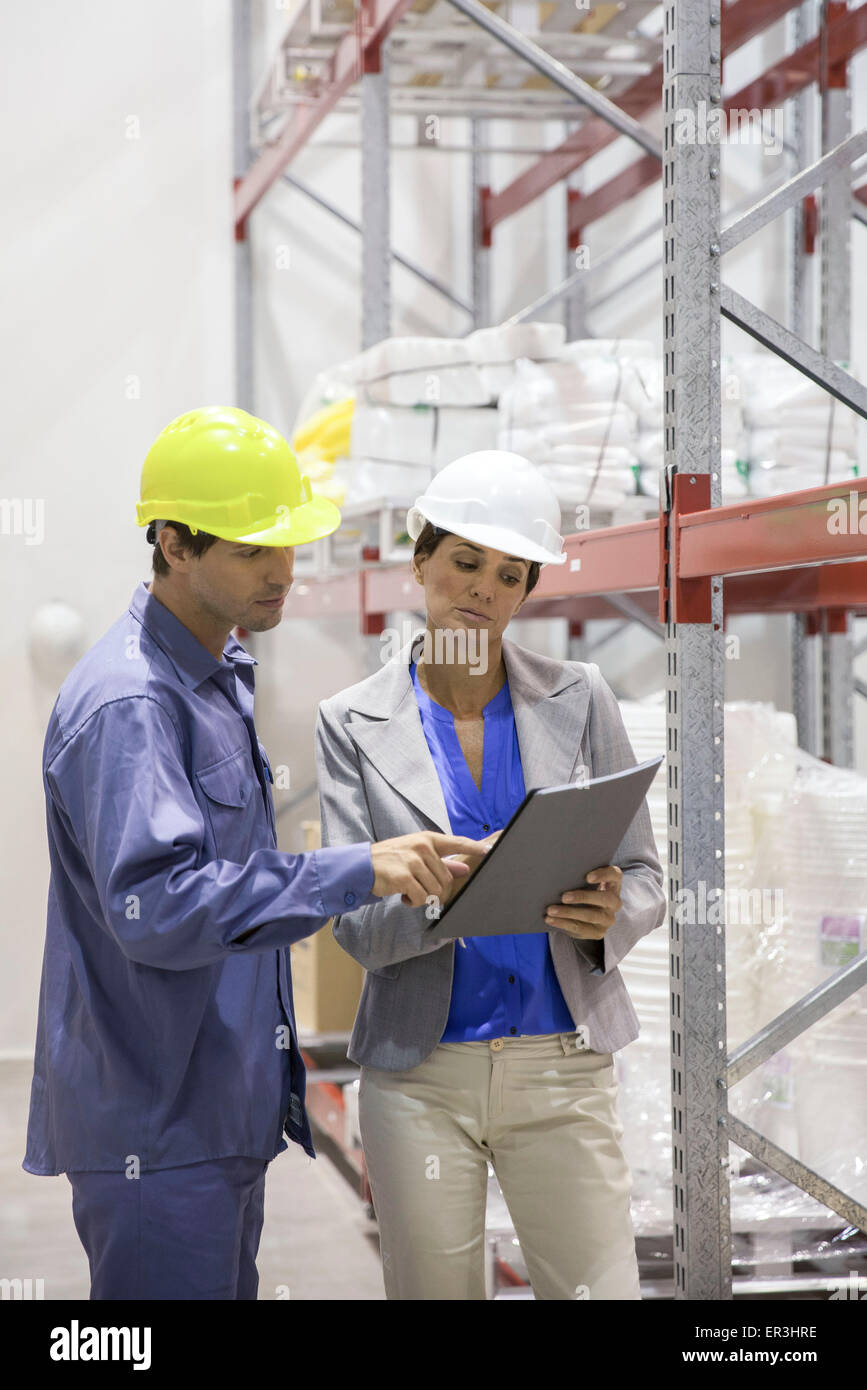 Side view two warehouse workers hi-res stock photography and images - Alamy