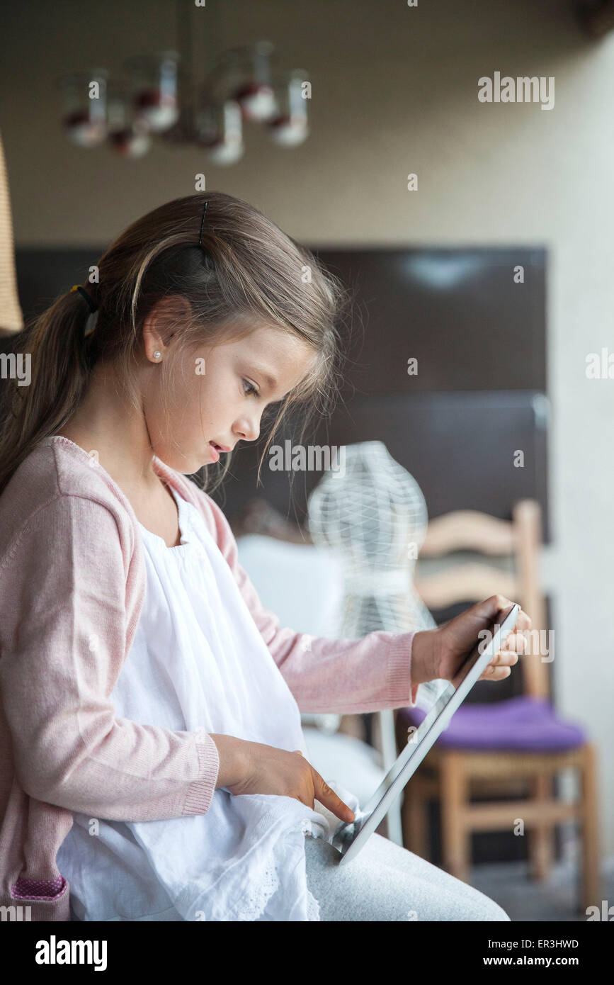 Little girl using digital tablet Stock Photo - Alamy